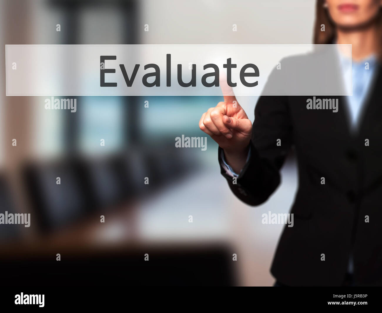 Evaluate - Businesswoman hand pressing button on touch screen interface ...