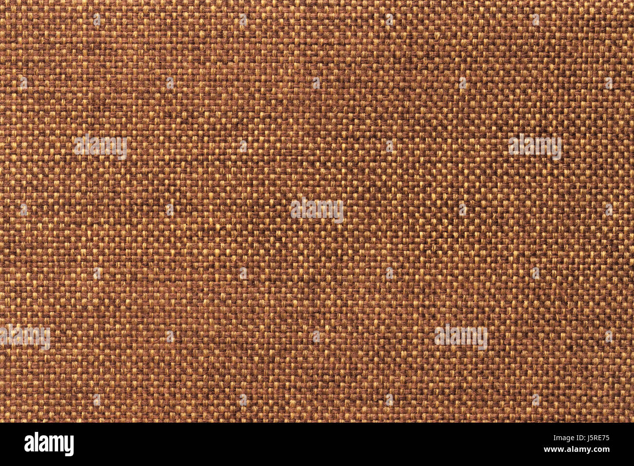 Dark orange woolen background of dense woven bagging fabric, closeup ...