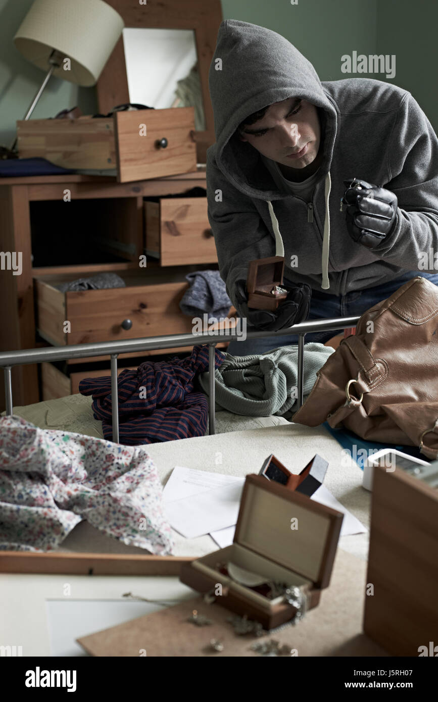 Burglar stealing jewelry hi-res stock photography and images - Alamy