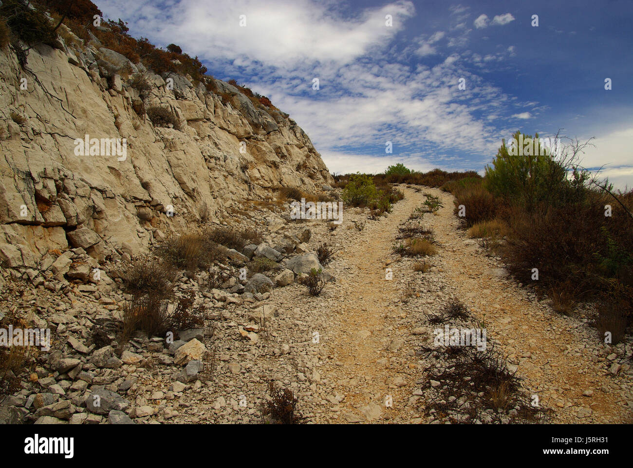 stone dirt road rock gravel track steep rise climb climbing ascend ...