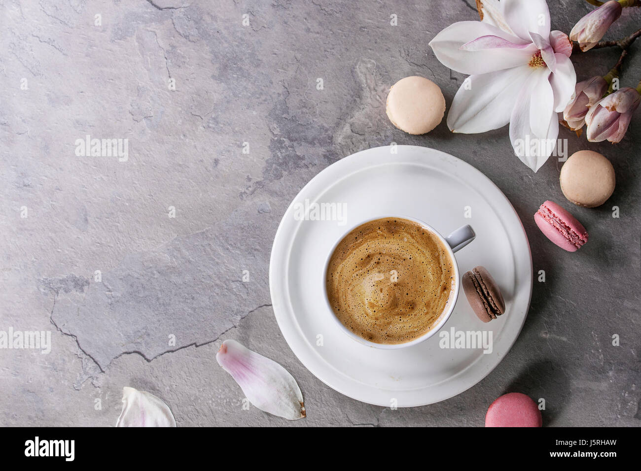Cup of black coffee with magnolia Stock Photo - Alamy