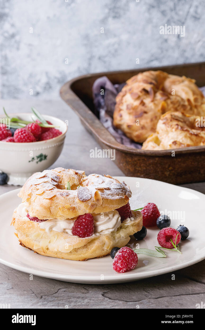 Choux cake Paris Brest with raspberries Stock Photo - Alamy