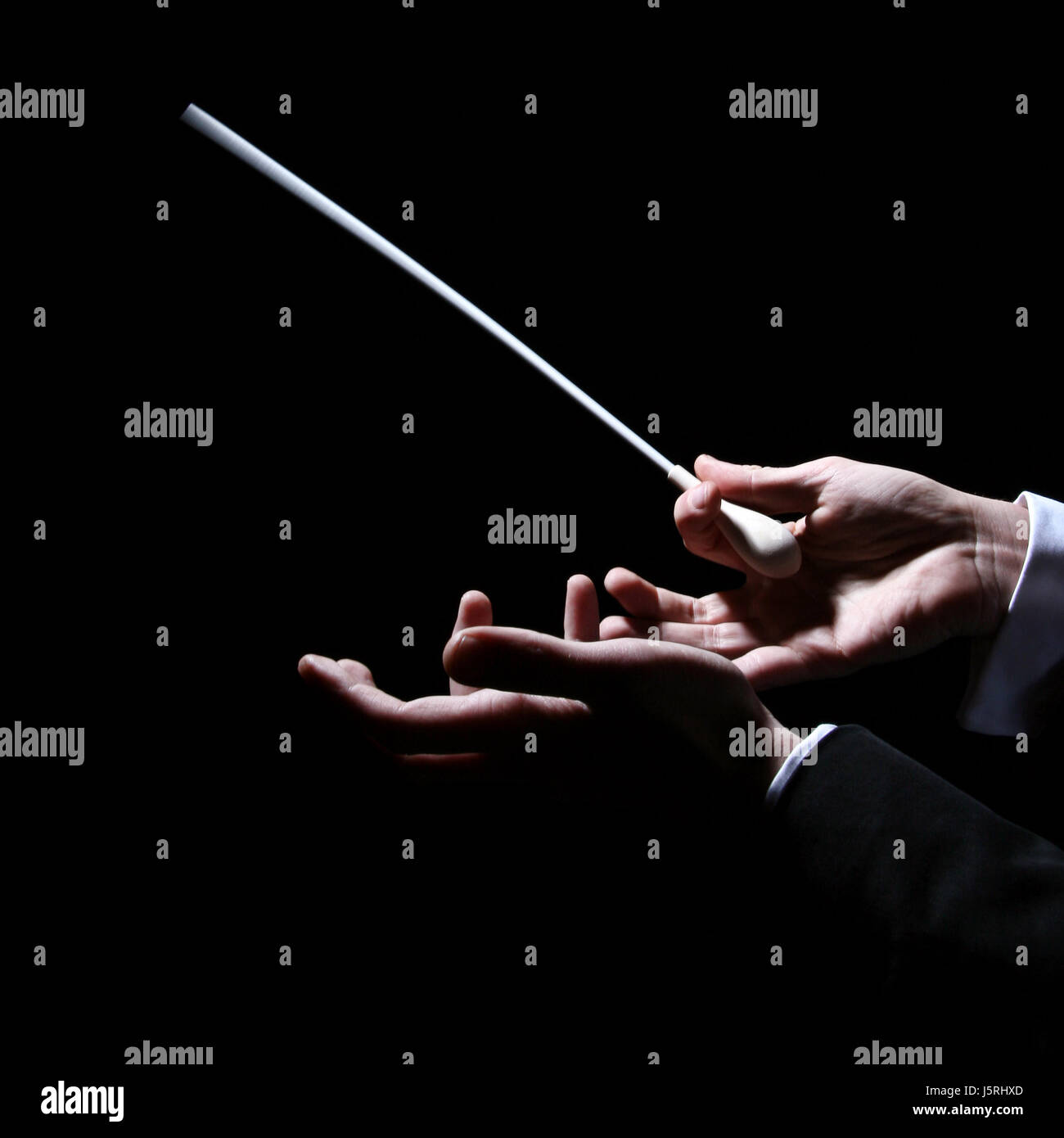 hands with baton Stock Photo - Alamy