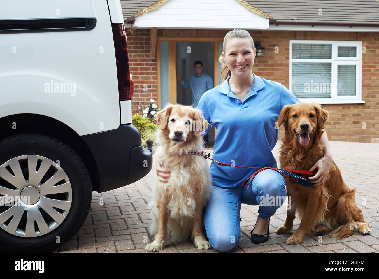 Portrait Of Woman Running Dog Walking Service Stock Photo - Alamy