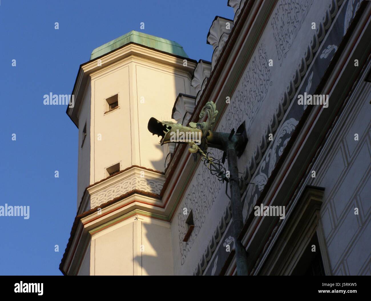 tower poses town hall poland gargoyle gutter cornice firmament sky ...