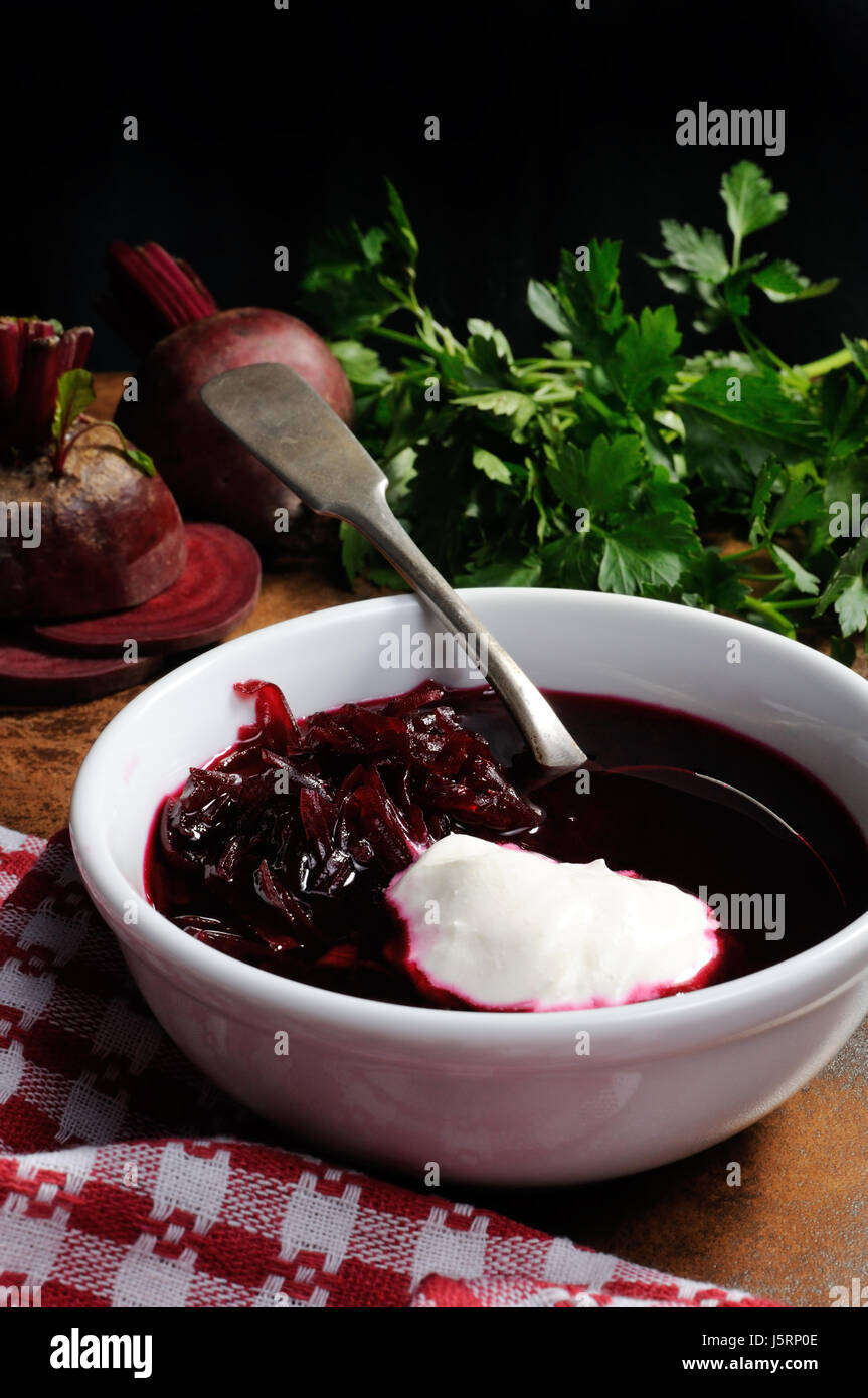 A dish of beet soup with sour cream. Vertical shot Stock Photo - Alamy