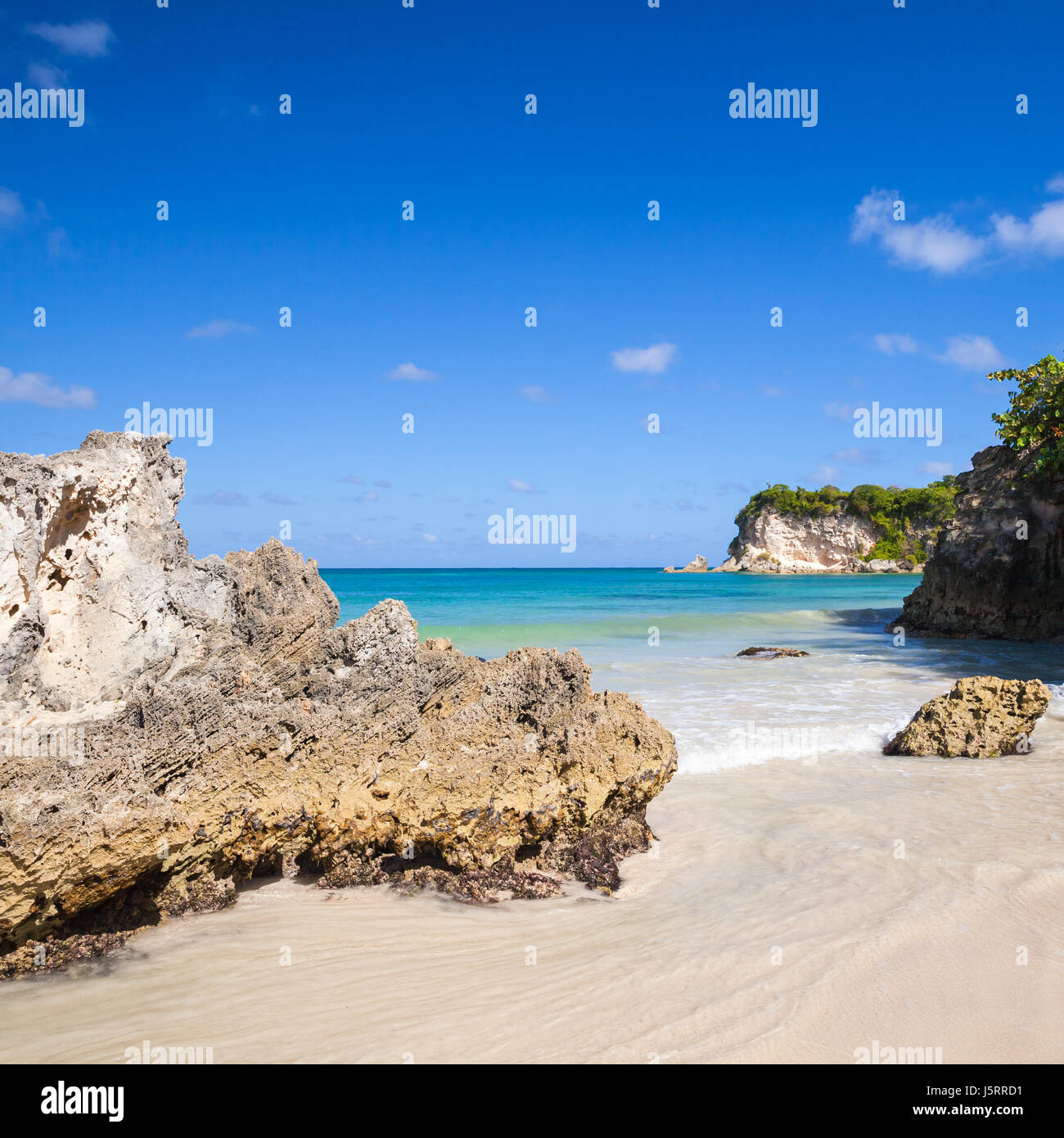 Coastal rocks and sand of Macao Beach, touristic resort of Dominican ...
