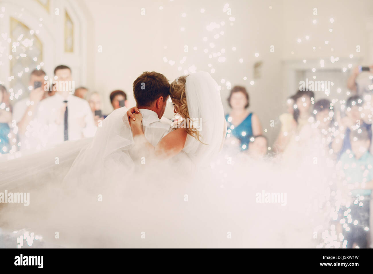 beautiful wedding couple dancing their first dance of the wedding ...