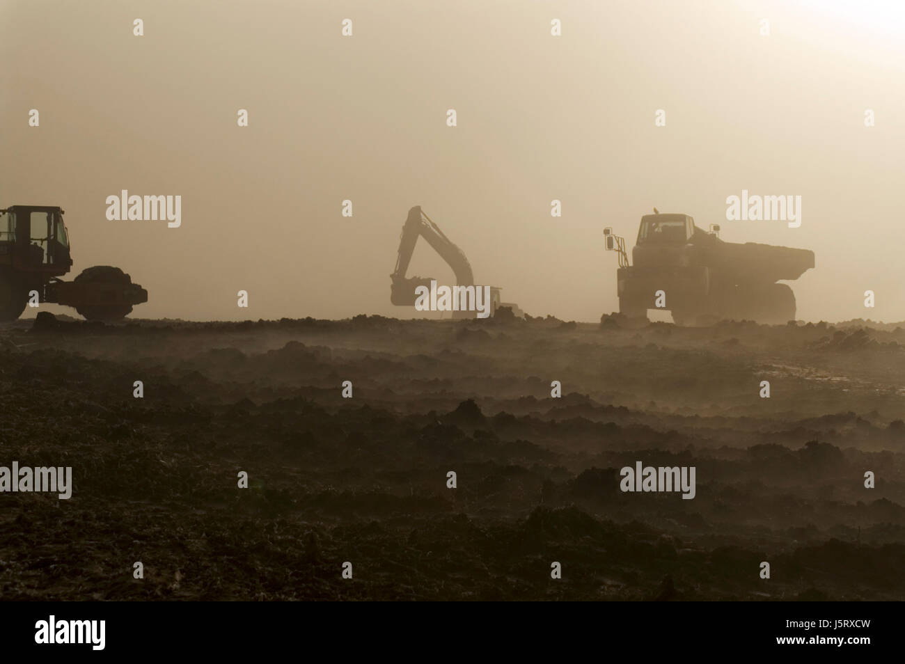 ground soil earth humus fog haze counter-light dredger caterpillar ...