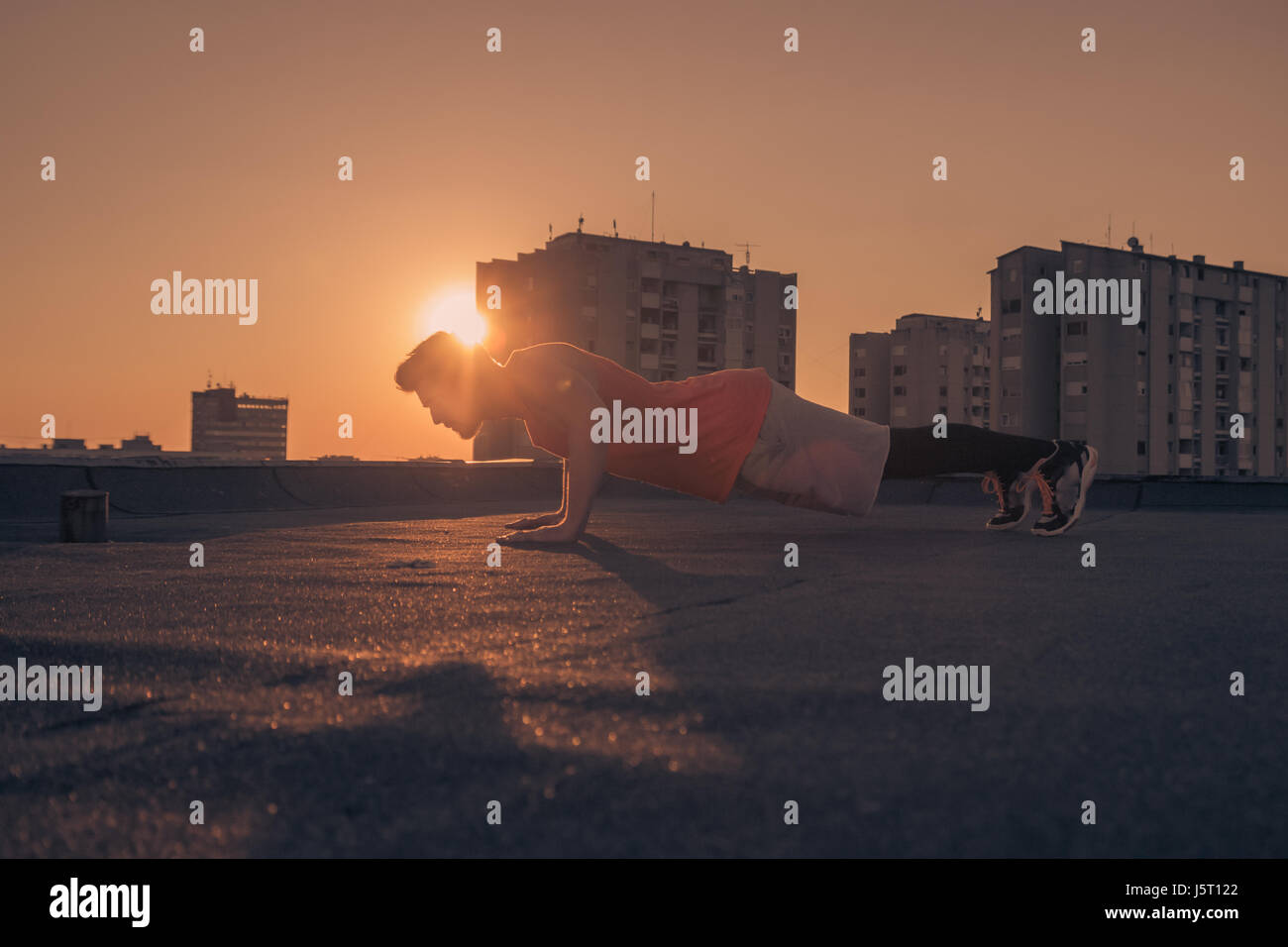 one young man only, sunset sunrise Sun sky, push-up exercise, shade ...