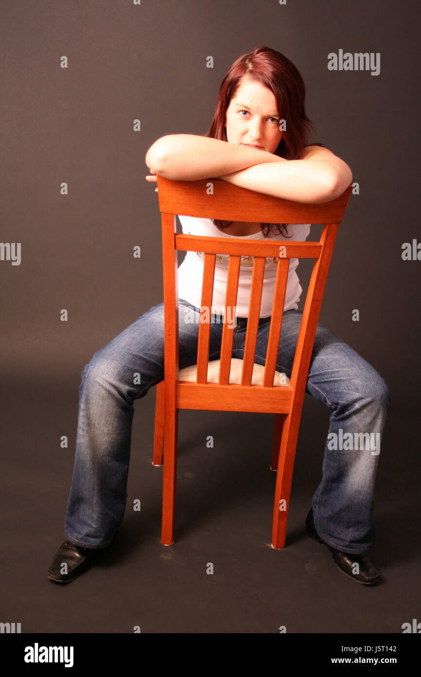 Woman astride chair hi-res stock photography and images - Alamy