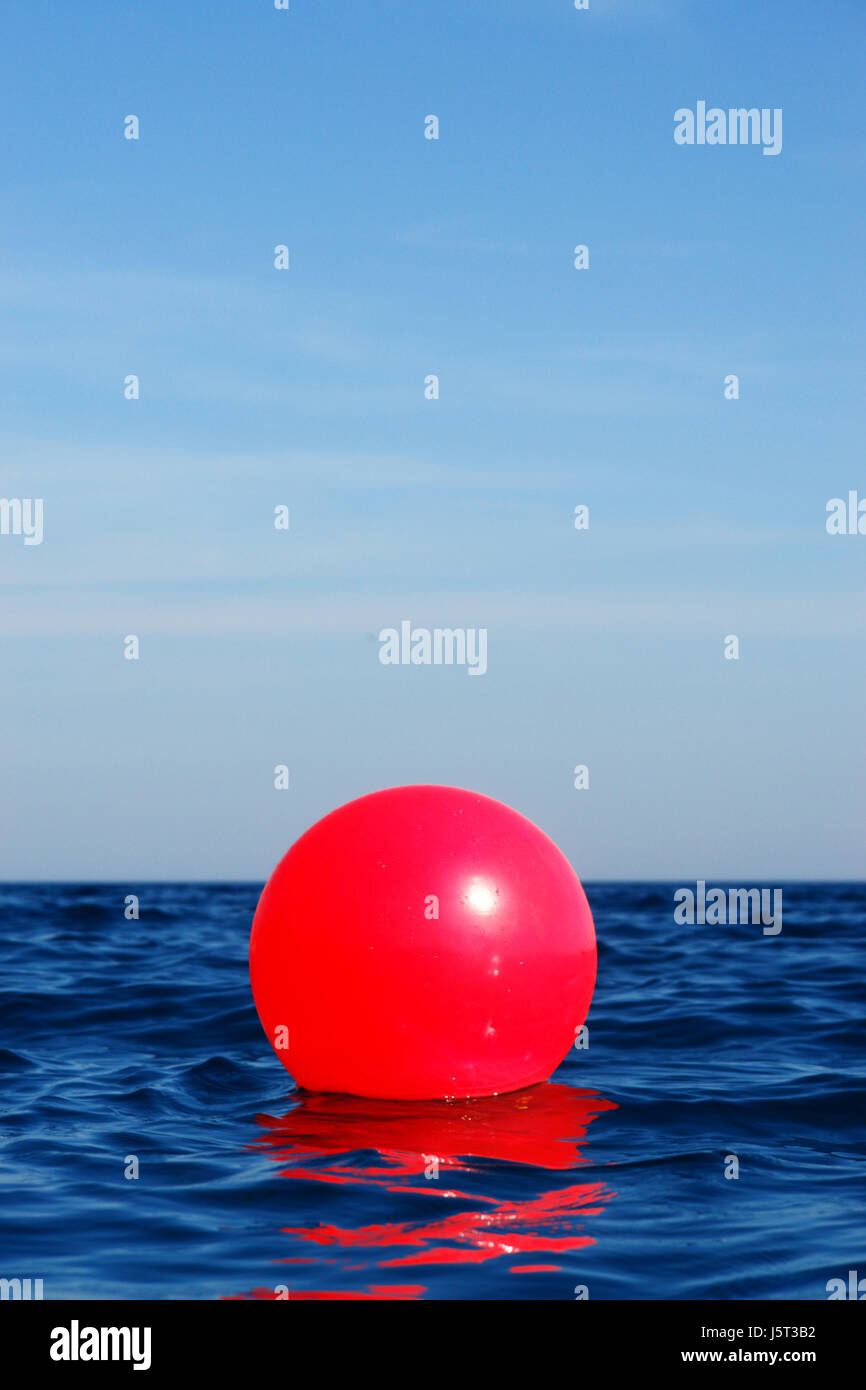 buoy red water sign signal blue waves buoy firmament sky salt water sea ...