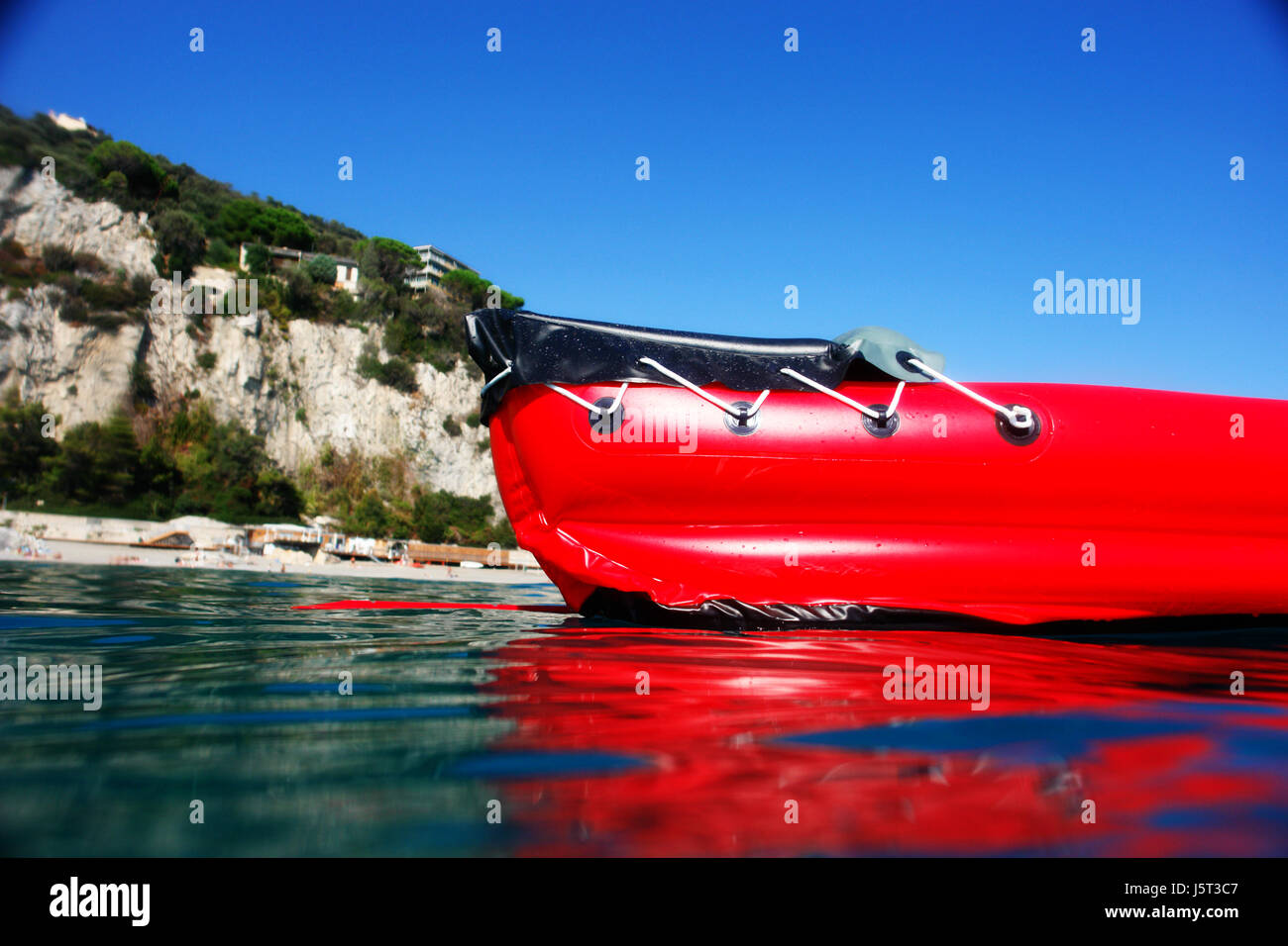 locomotion rubber dinghy salt water sea ocean water red rowing boat ...