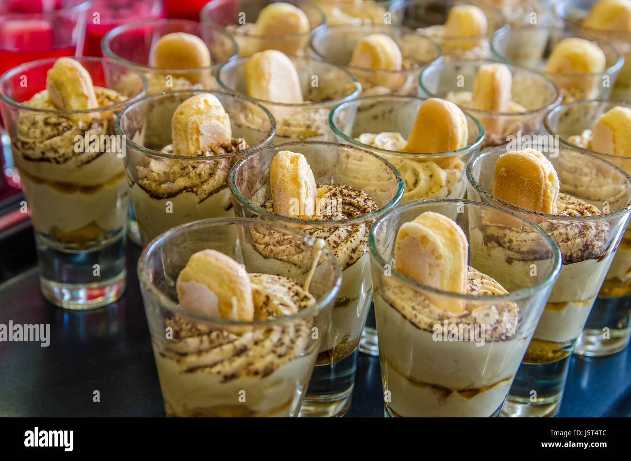 Tiramisu in the glass cup and display on the dessert table Stock Photo ...