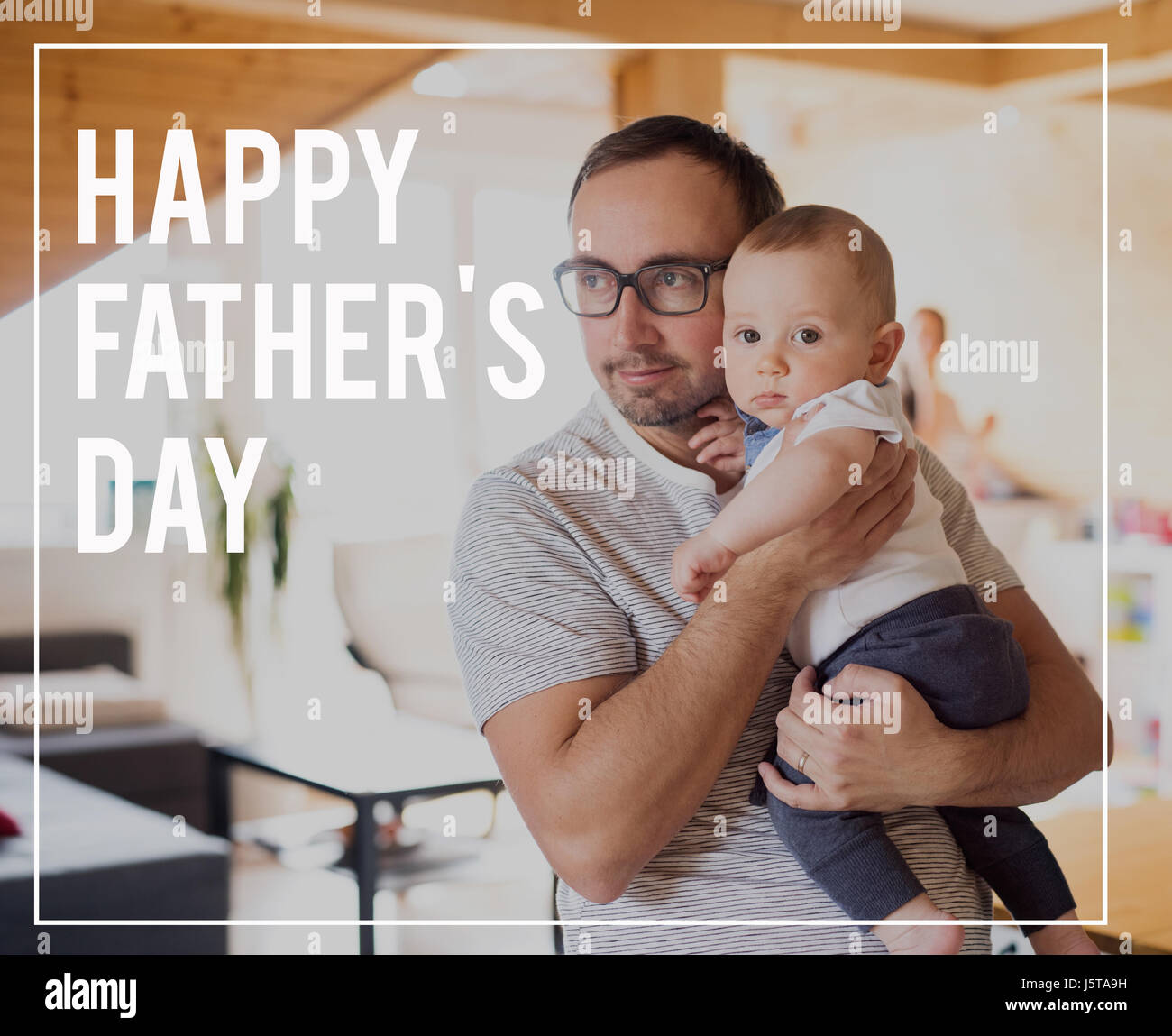 Father holding baby son in the arms. Fathers day Stock Photo - Alamy