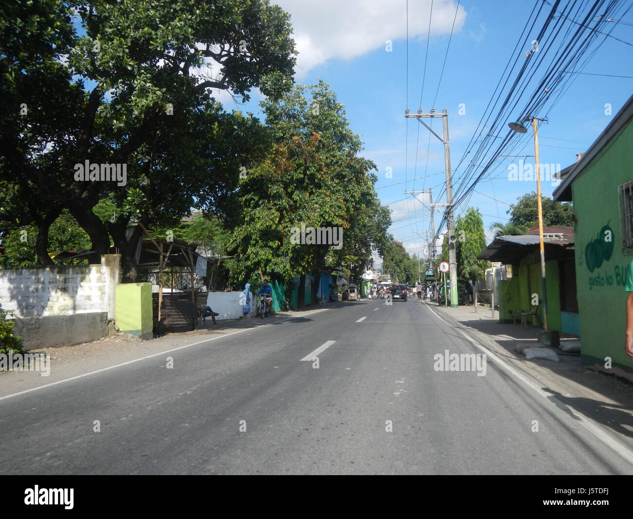 This image shows the municipal road connecting various barangays in ...