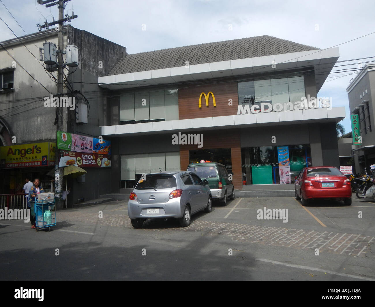 A photograph capturing B. S. Aquino Avenue in the Bagong Nayon area of ...