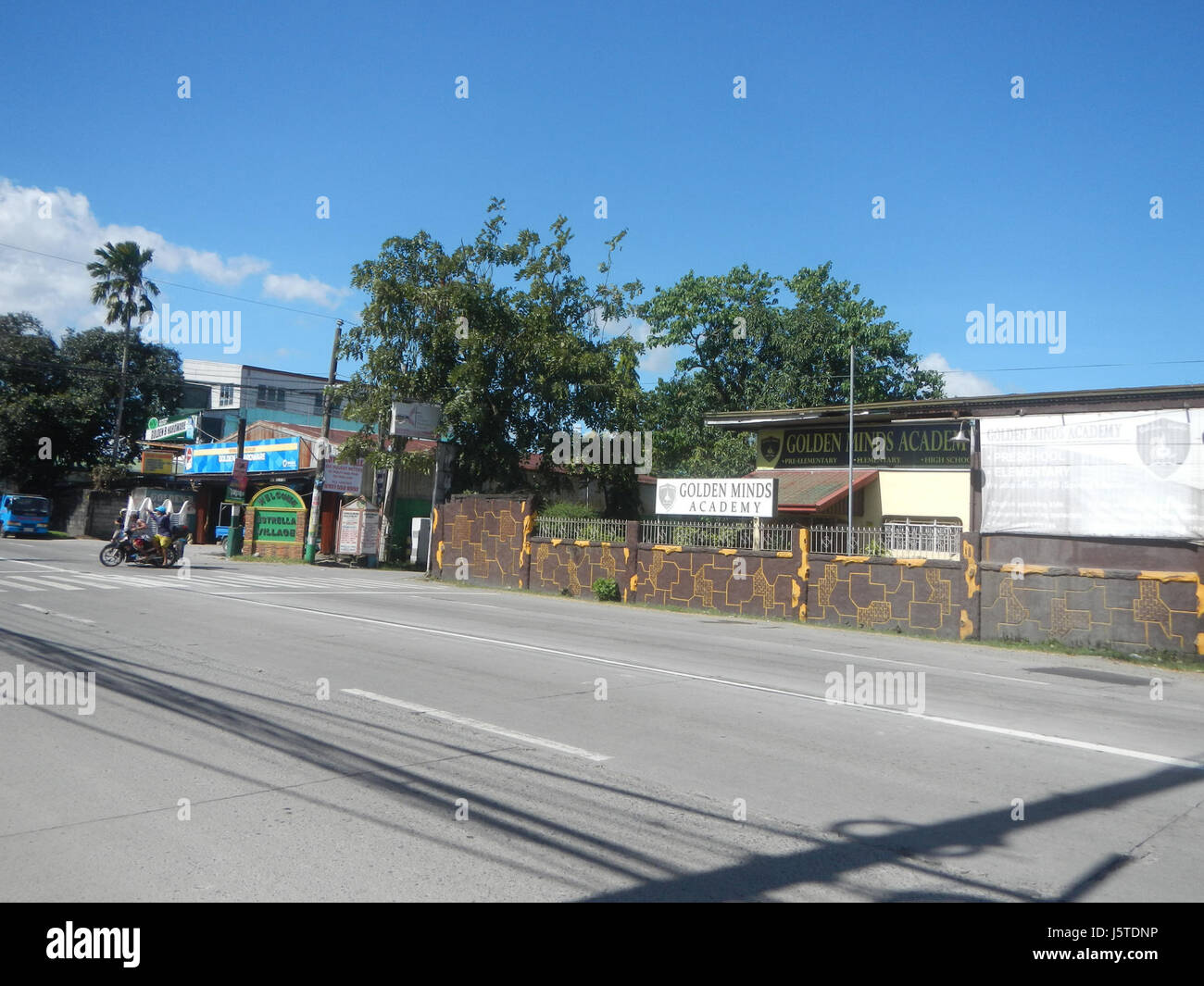 This photograph shows a section of the MacArthur Highway in Malolos and ...