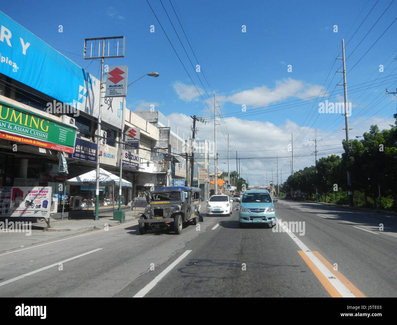 This image depicts the MacArthur Highway, a significant road in the ...