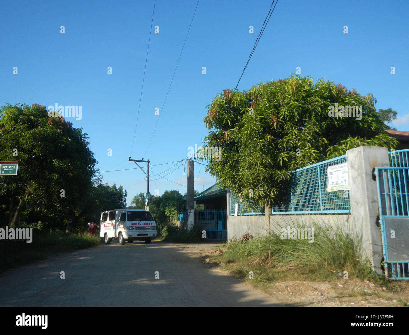 This image presents grasslands and paddy fields along a Farm to Market ...