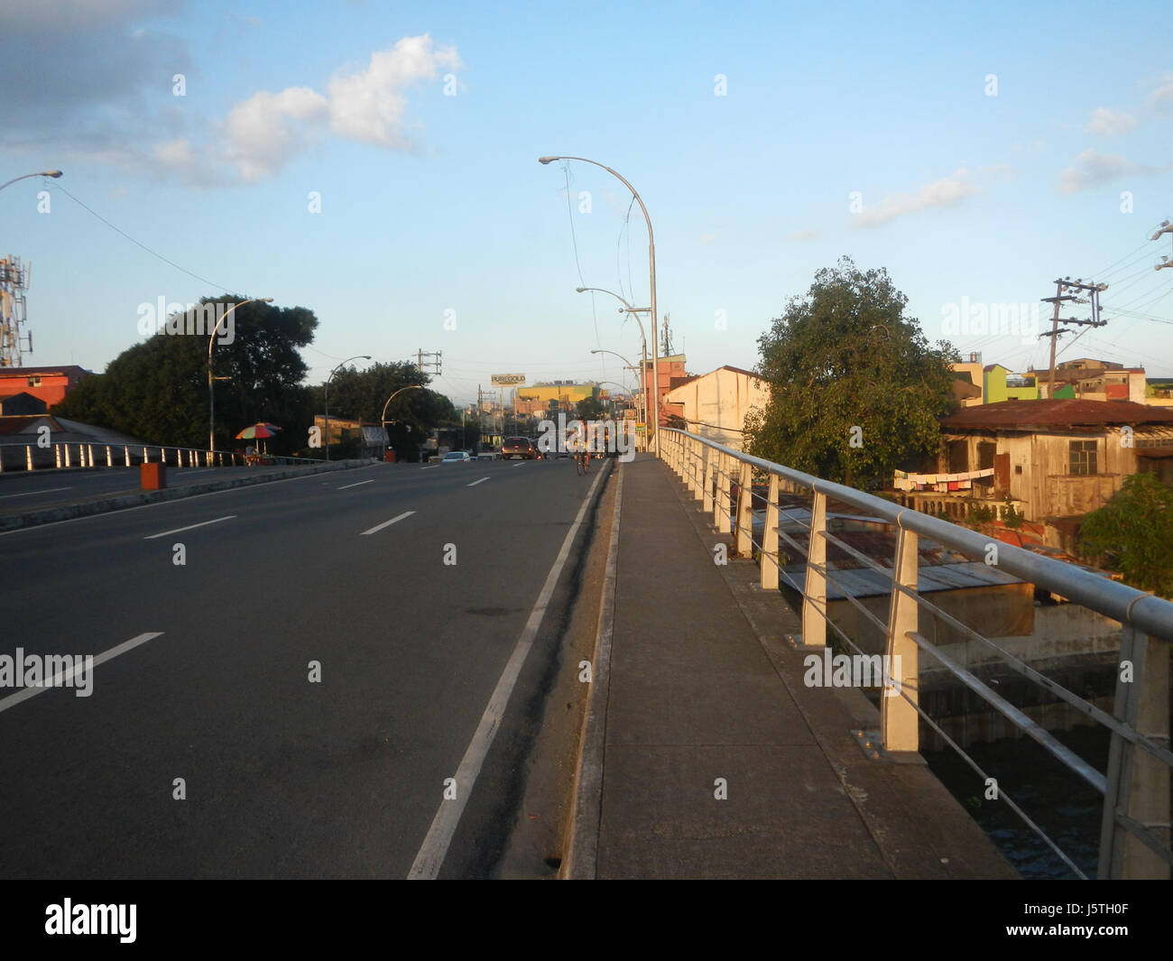 This image shows Lambingan Bridge over the Pasig River in Manila ...
