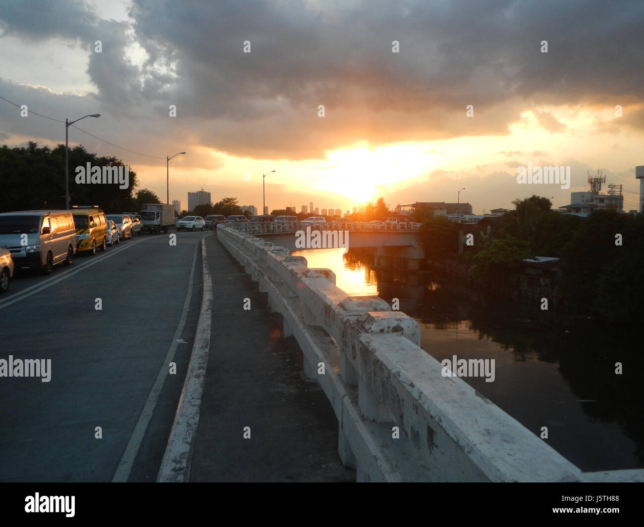 This image depicts a sunset over Kalentong, Santa Ana, and Mandaluyong ...