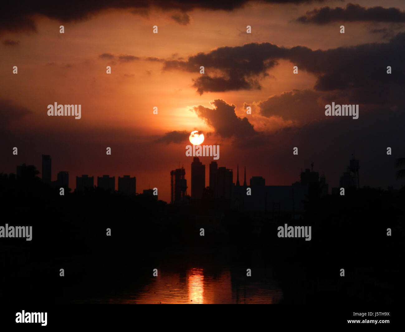 A photograph taken in Mandaluyong City, showcasing the sunset over the ...