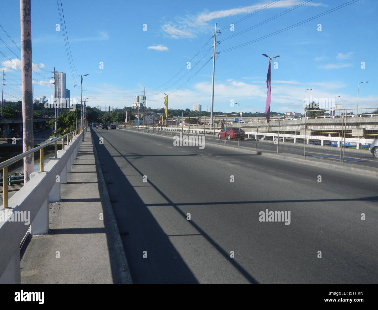 This image captures a footbridge located along the Marcos Highway in ...