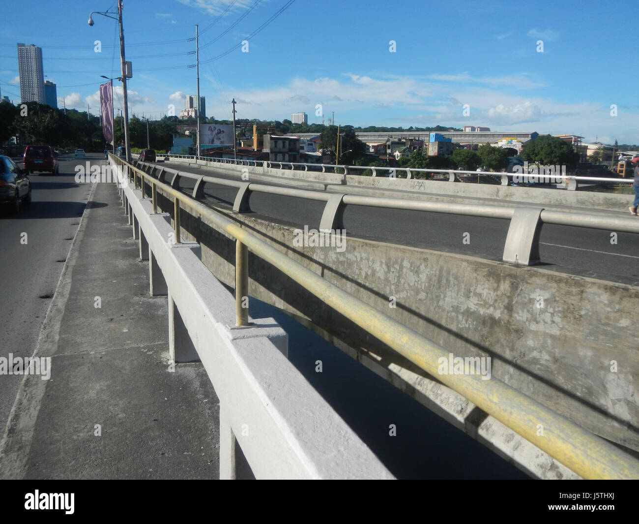 The Marcos Bridge, spanning the Marikina River, connects the Barangays ...