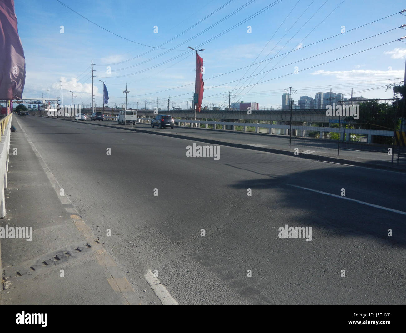 The image shows the footbridge along Marcos Highway in Marikina City ...