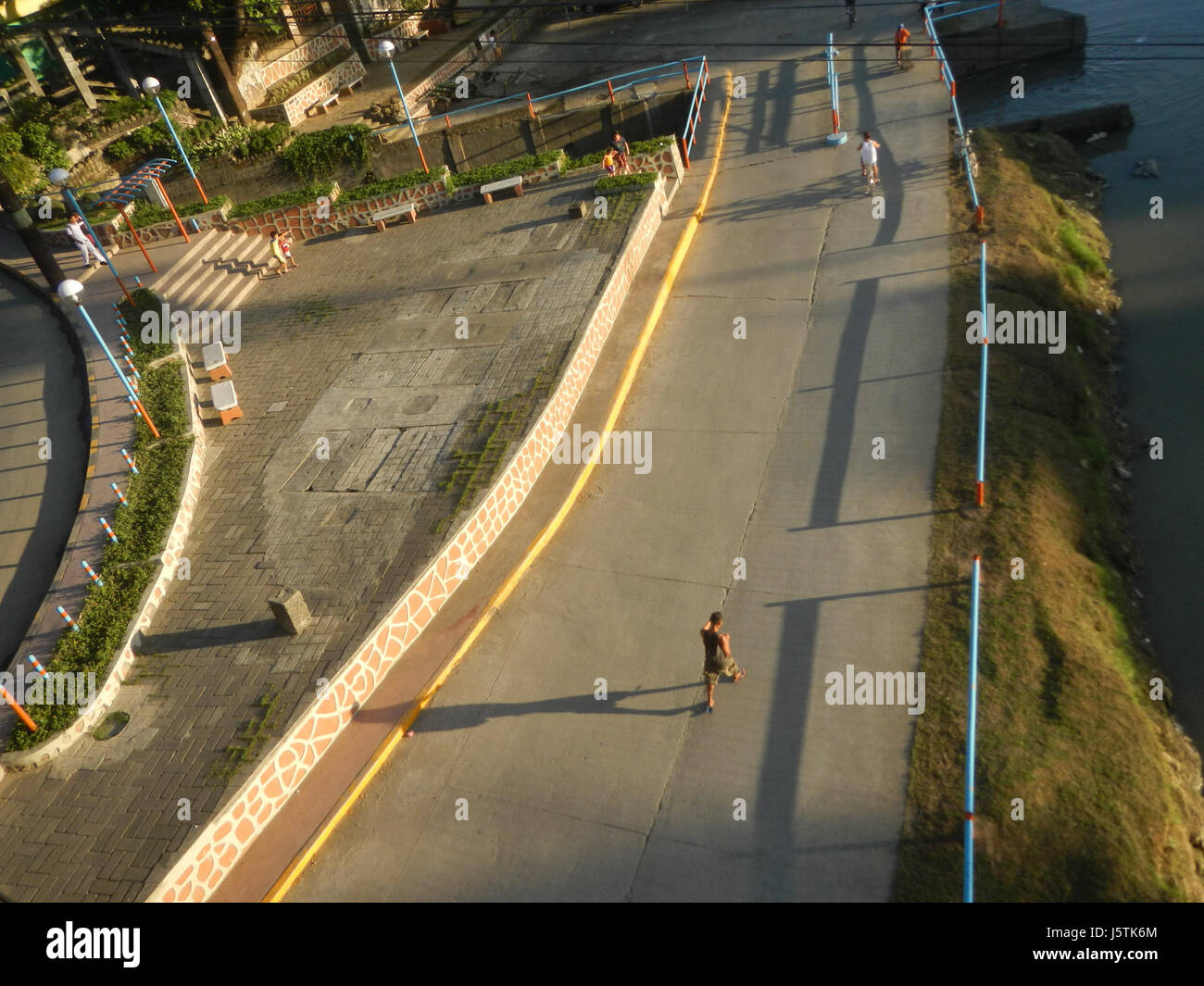 The image depicts the Marikina Bridge, which spans the Marikina River ...