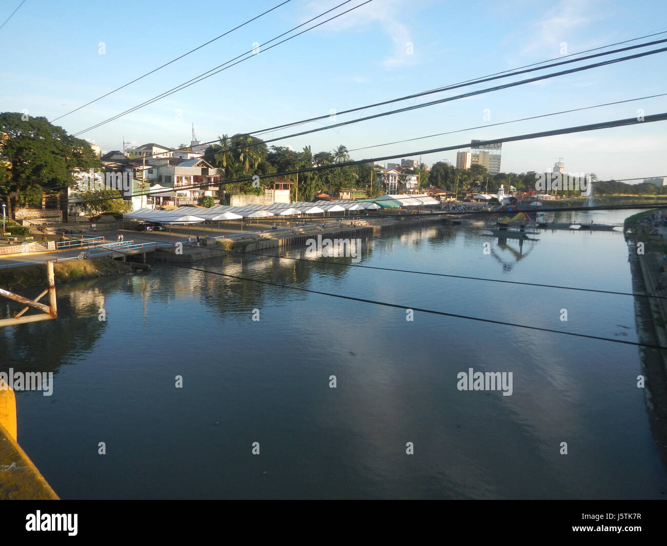 The image depicts the Marikina City Bridge over the City River, a key ...