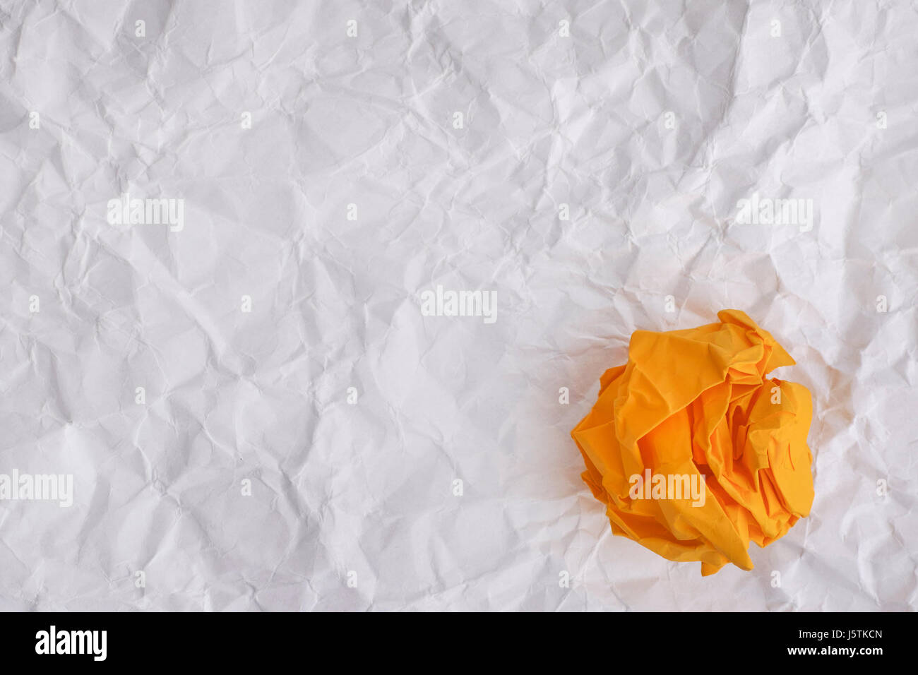 Yellow paper ball on crumpled paper background. Idea Concept Stock ...