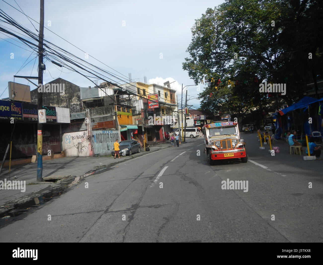 This photograph captures a street view of Barangays Maysilo Circle ...