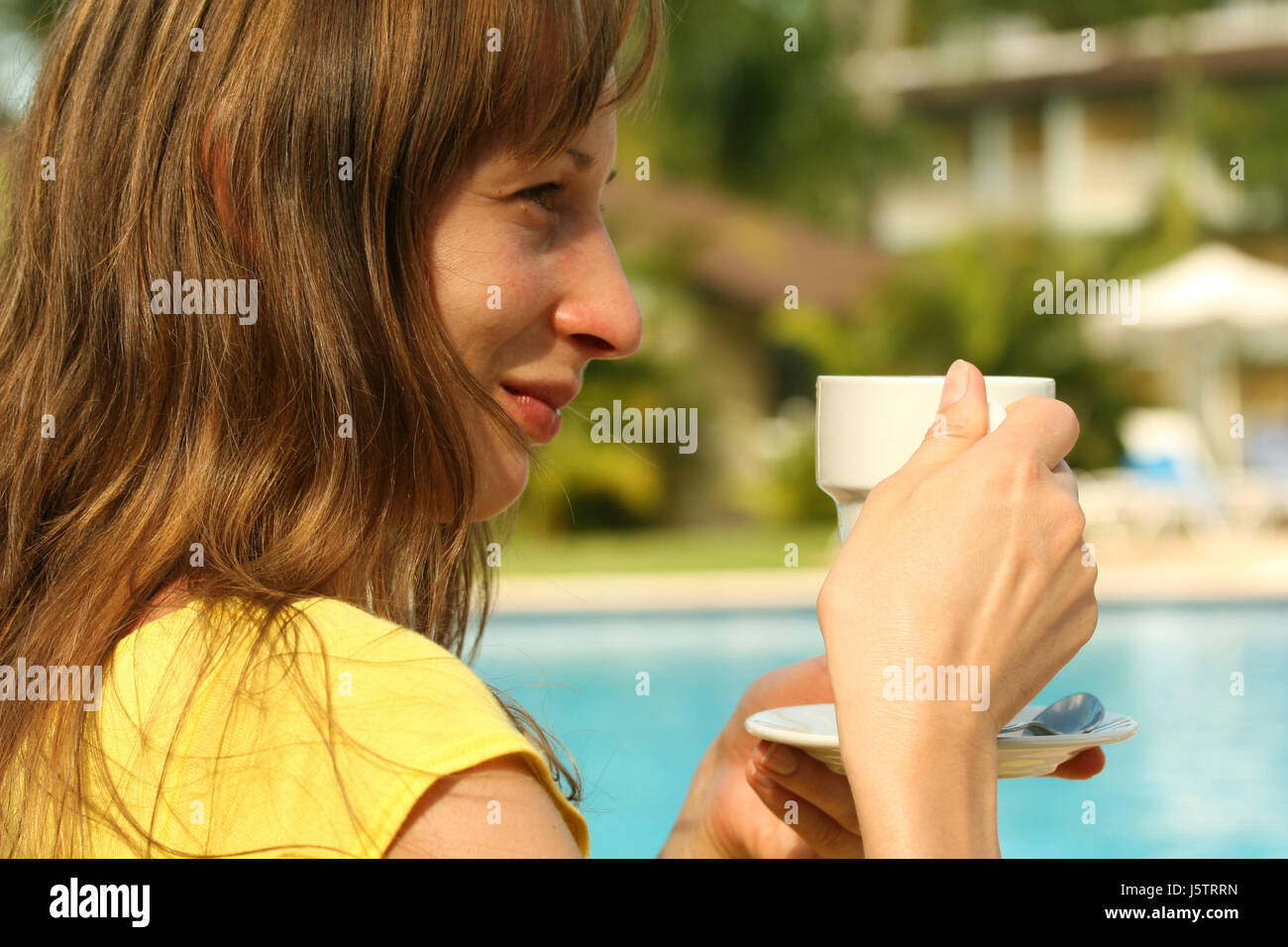drinking coffee by the pool Stock Photo - Alamy