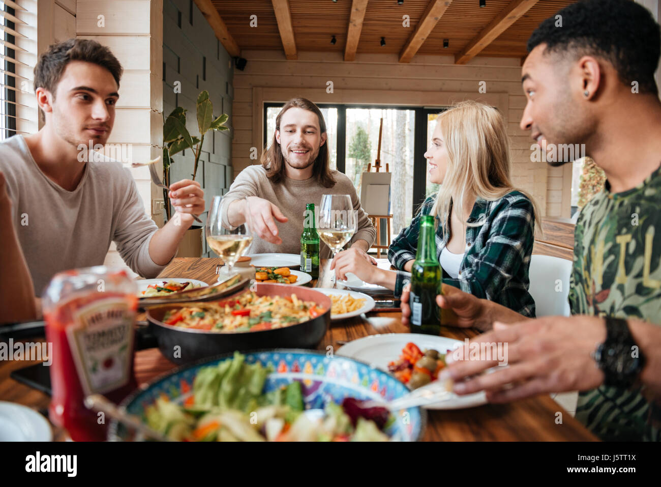 Urban family eating dinner hi-res stock photography and images - Alamy