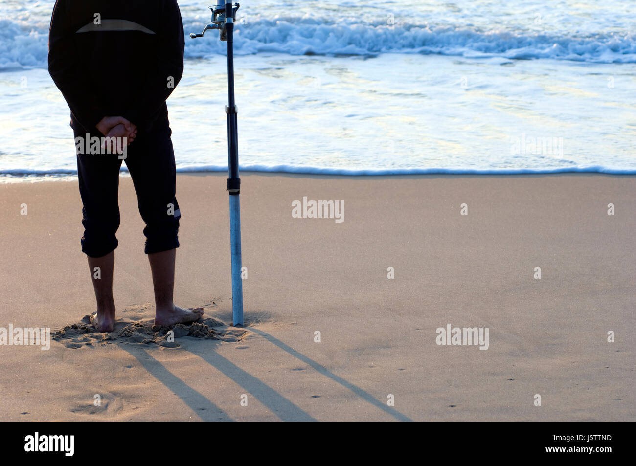 beach seaside the beach seashore hobby barefoot silhouette fisherman ...