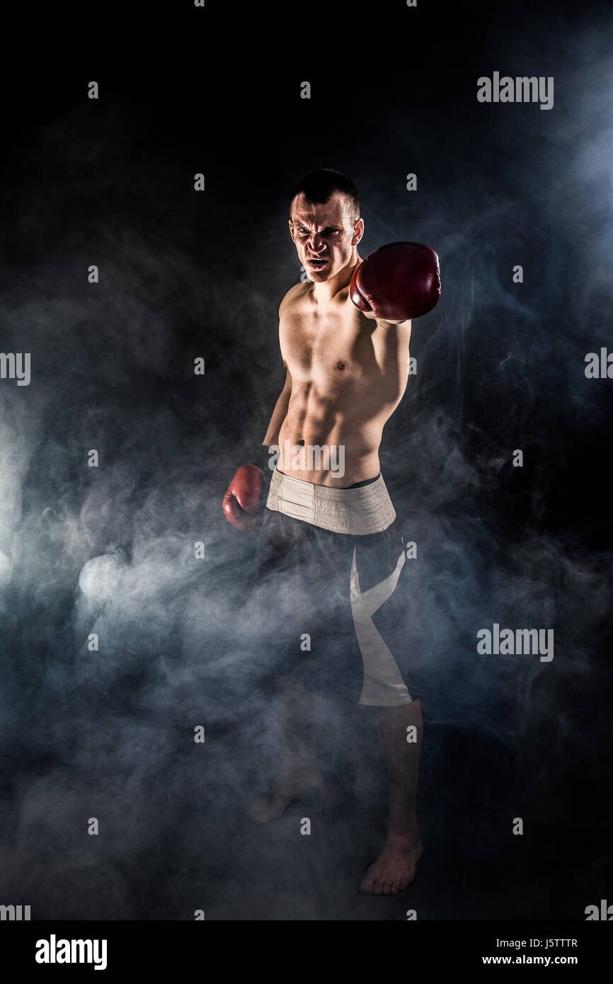 Happy Mixed Martial Arts Fighter in Smoke Stock Photo - Alamy