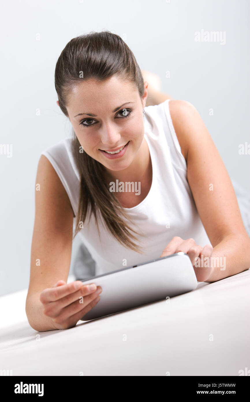 Portrait of smiling young woman whit her digital touchpad Stock Photo ...
