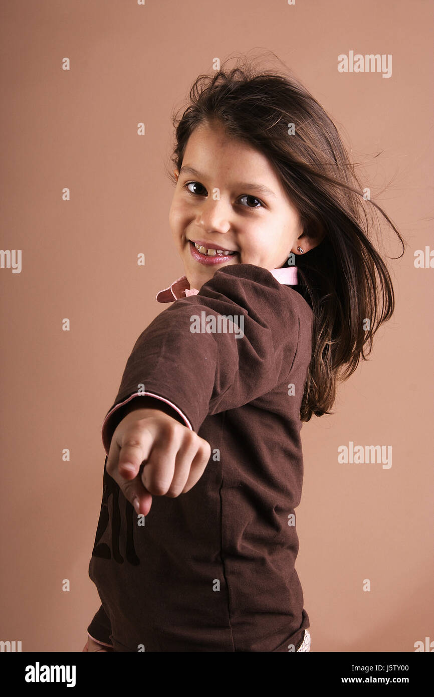 indicate show forefinger hint schoolchild child pointing girl girls ...