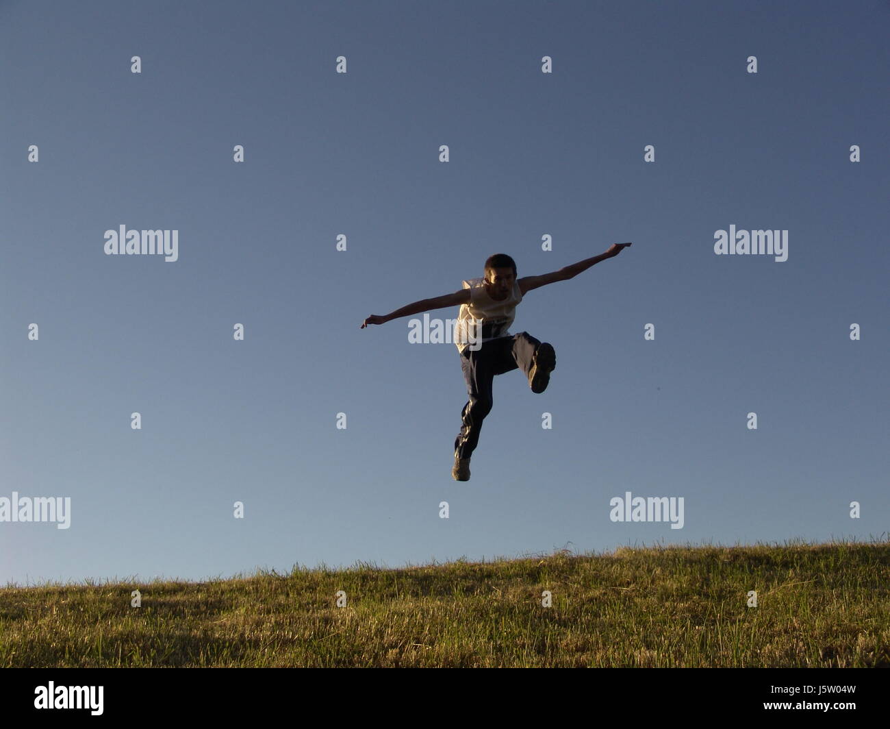 spring bouncing bounces hop skipping frisks jumping jump caper boy lad ...