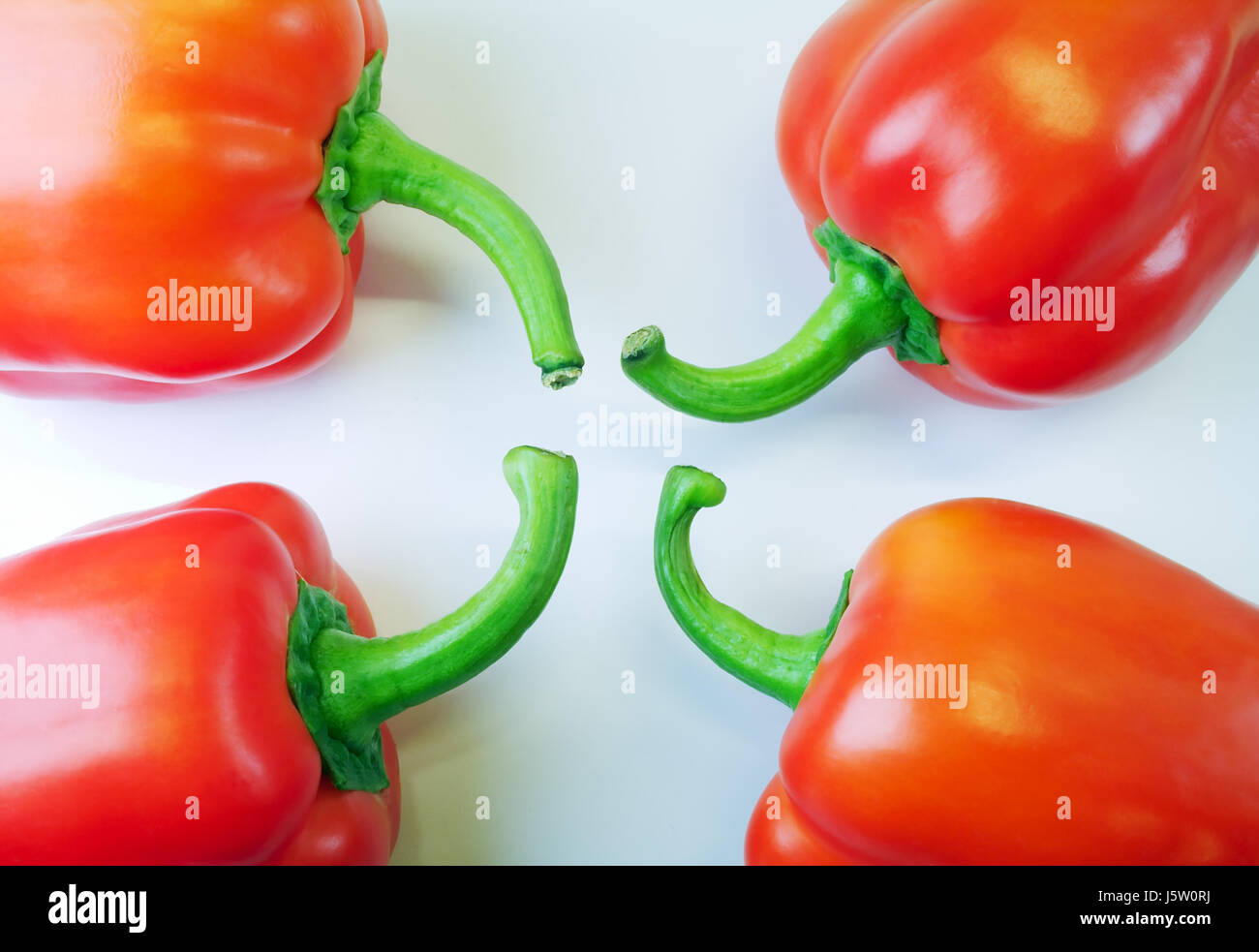 four red peppers in a star shape Stock Photo - Alamy