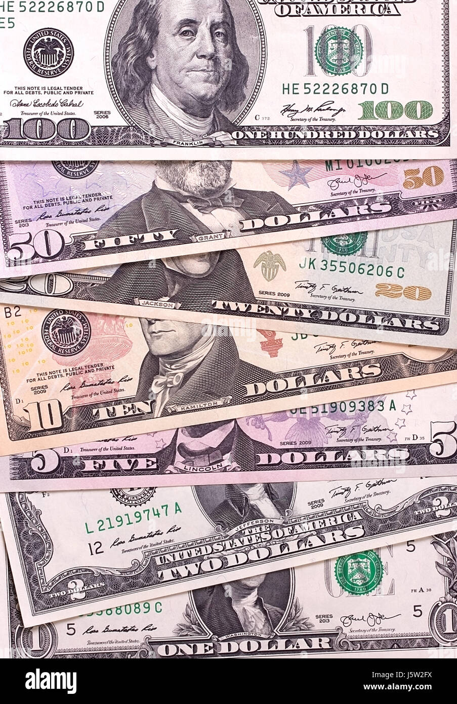 Abstract dollar bills of different denominations background Stock Photo ...
