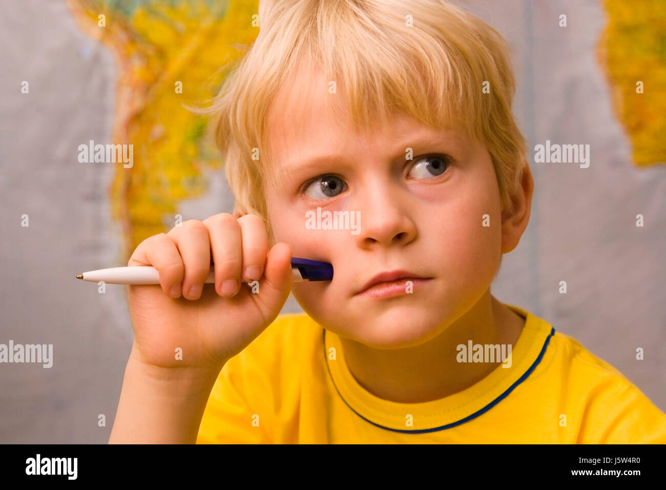 small tiny little short smart kid thinking map boy lad male youngster ...