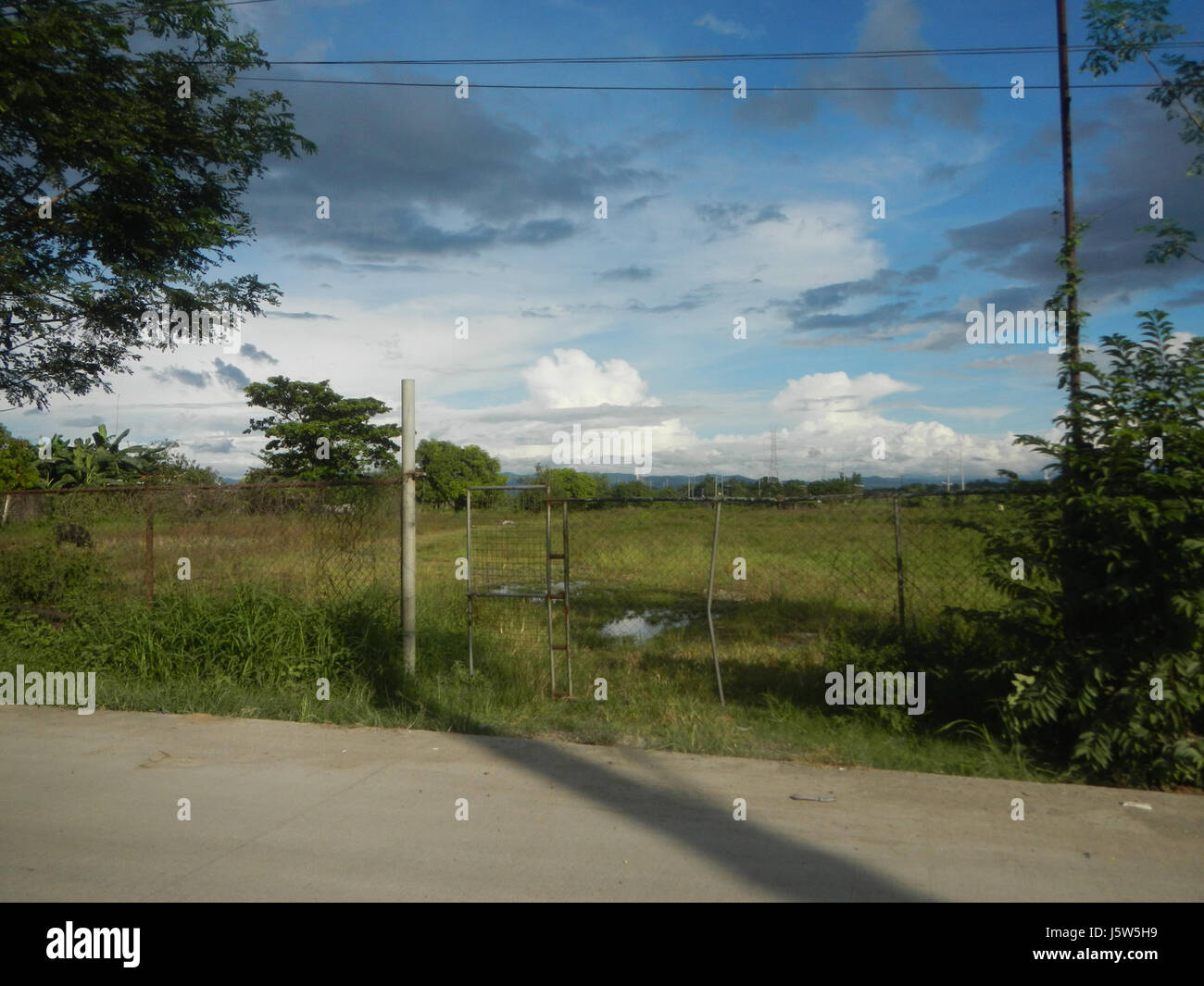 A photograph showing the rural landscape of San Rafael, Bulacan, with ...