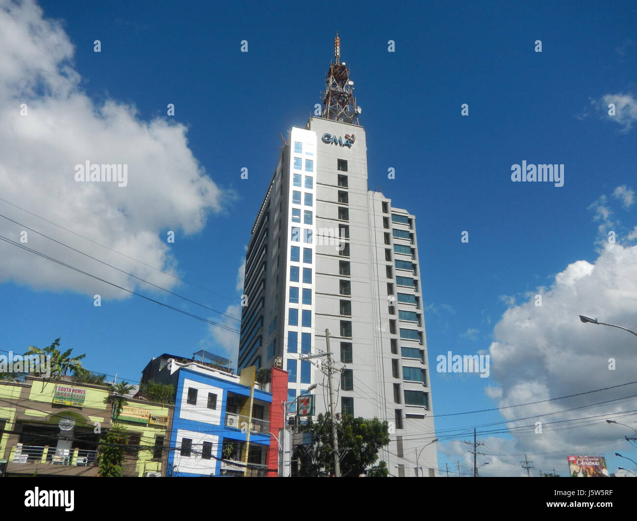 A photograph of the GMA Network Center on Timog Avenue, a major ...