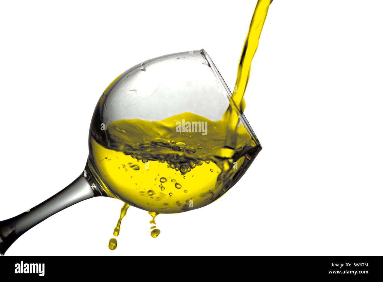 Yellow liquid, water, apple juice, white wine pouring into a glass ...
