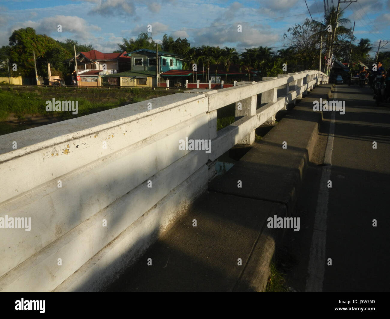 A sunset view over the San Miguel Bridge in San Juan, Bulacan, showing ...