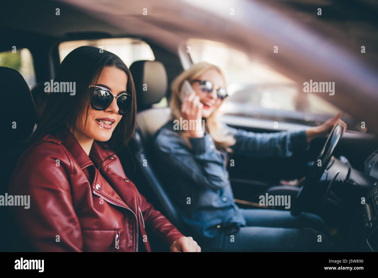 Friends On A Road Trip Talking In Car High Resolution Stock Photography ...