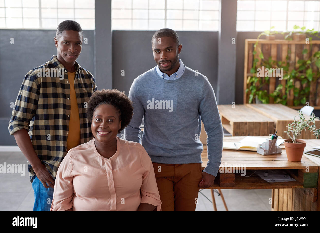 Smiling young African coworkers at work in a modern office Stock Photo ...